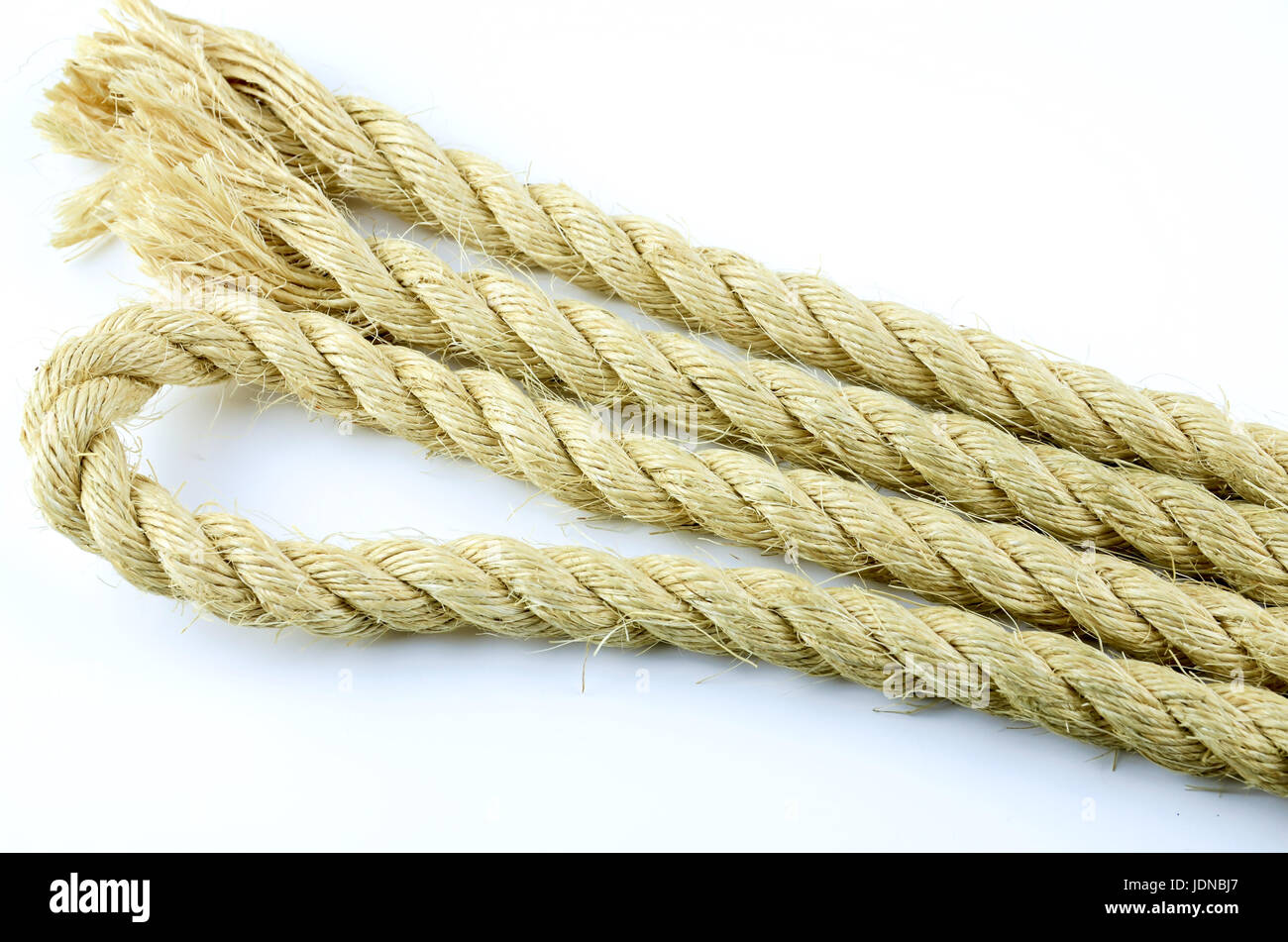 Rope rolled up on a white background. seamless Stock Photo - Alamy