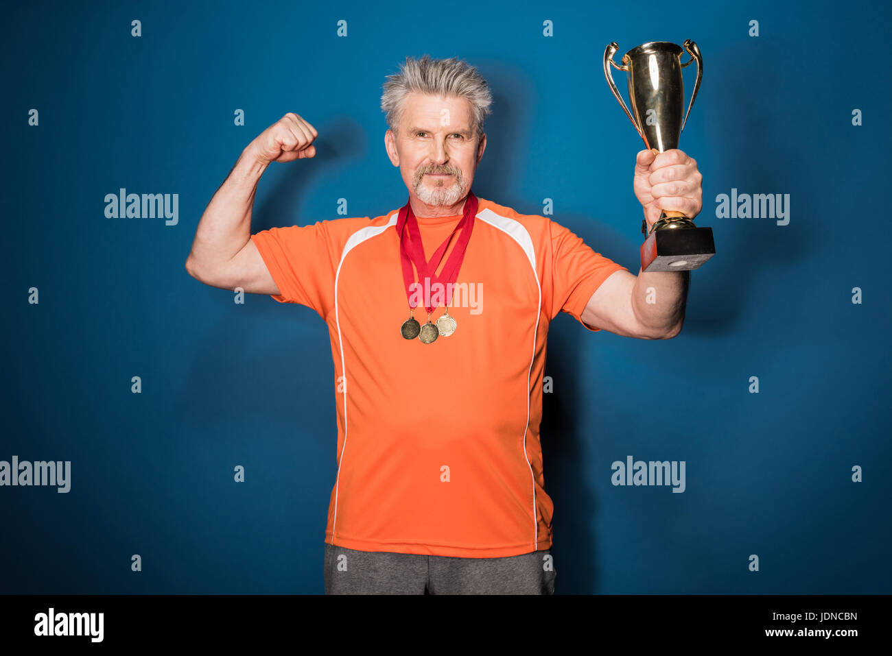Man holding trophy hi-res stock photography and images - Alamy