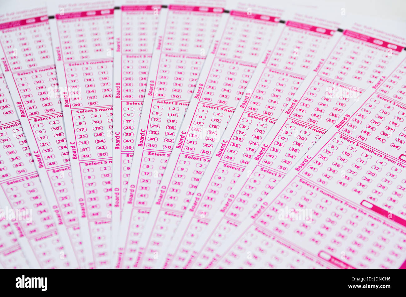 Blank lotto tickets scattered on white background Stock Photo - Alamy