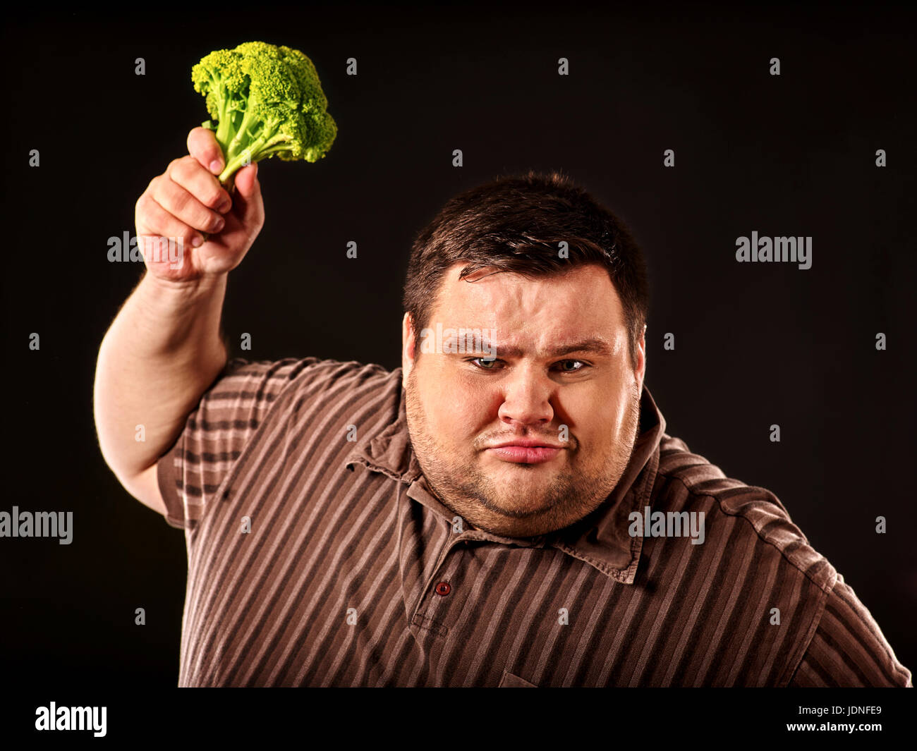 Diet fat man eating healthy food . Healthy breakfast vegetables ...