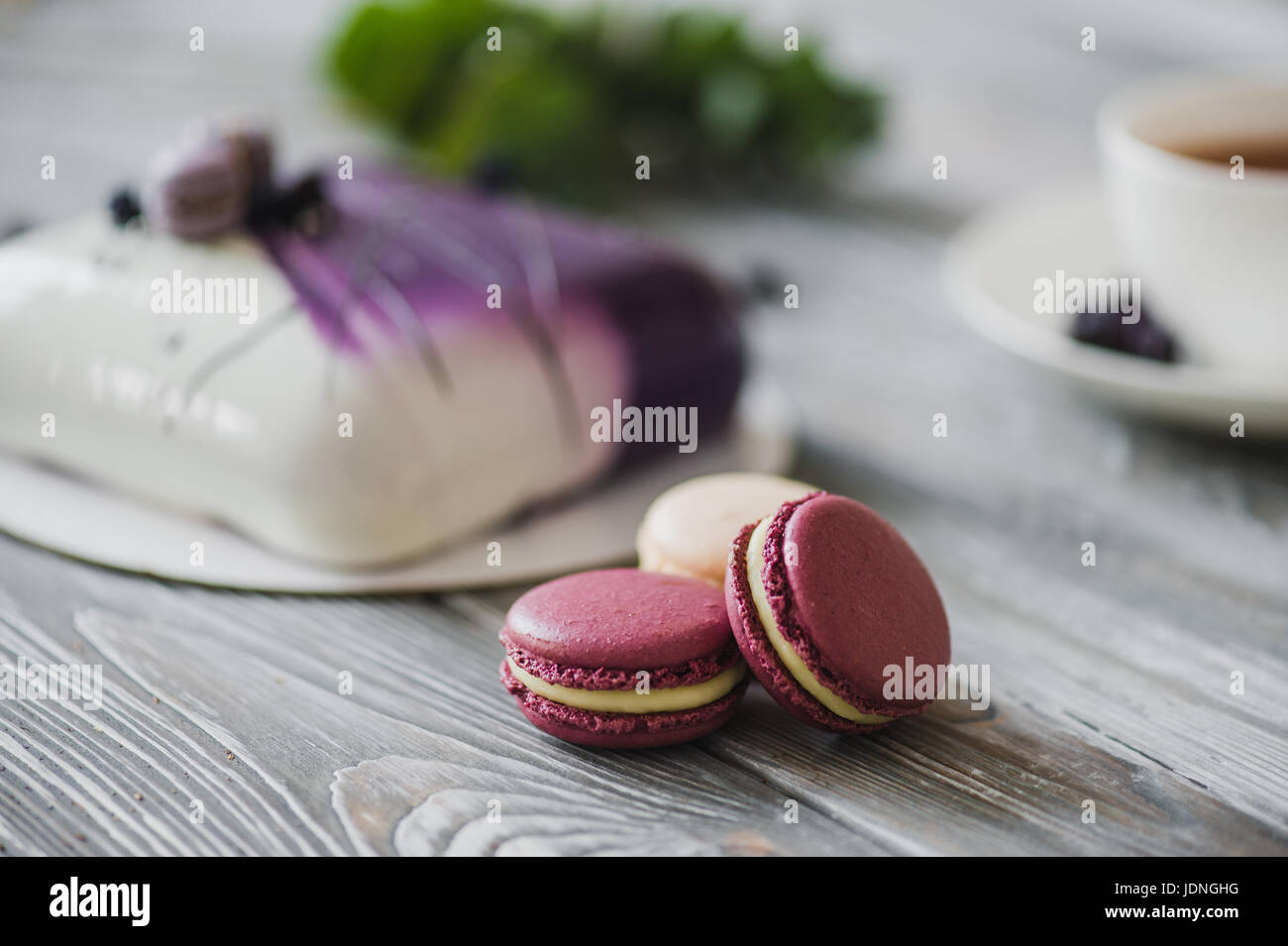 Traditional purple berry cake and macarons souffle dessert and almond ...