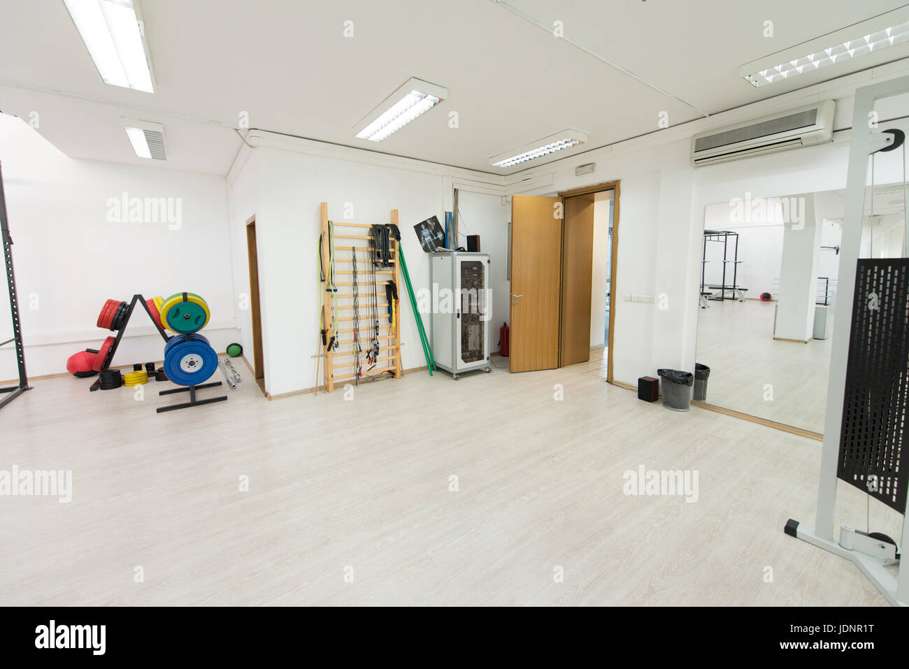 Modern Gym Room Fitness Center With Equipment And Machines Stock Photo ...
