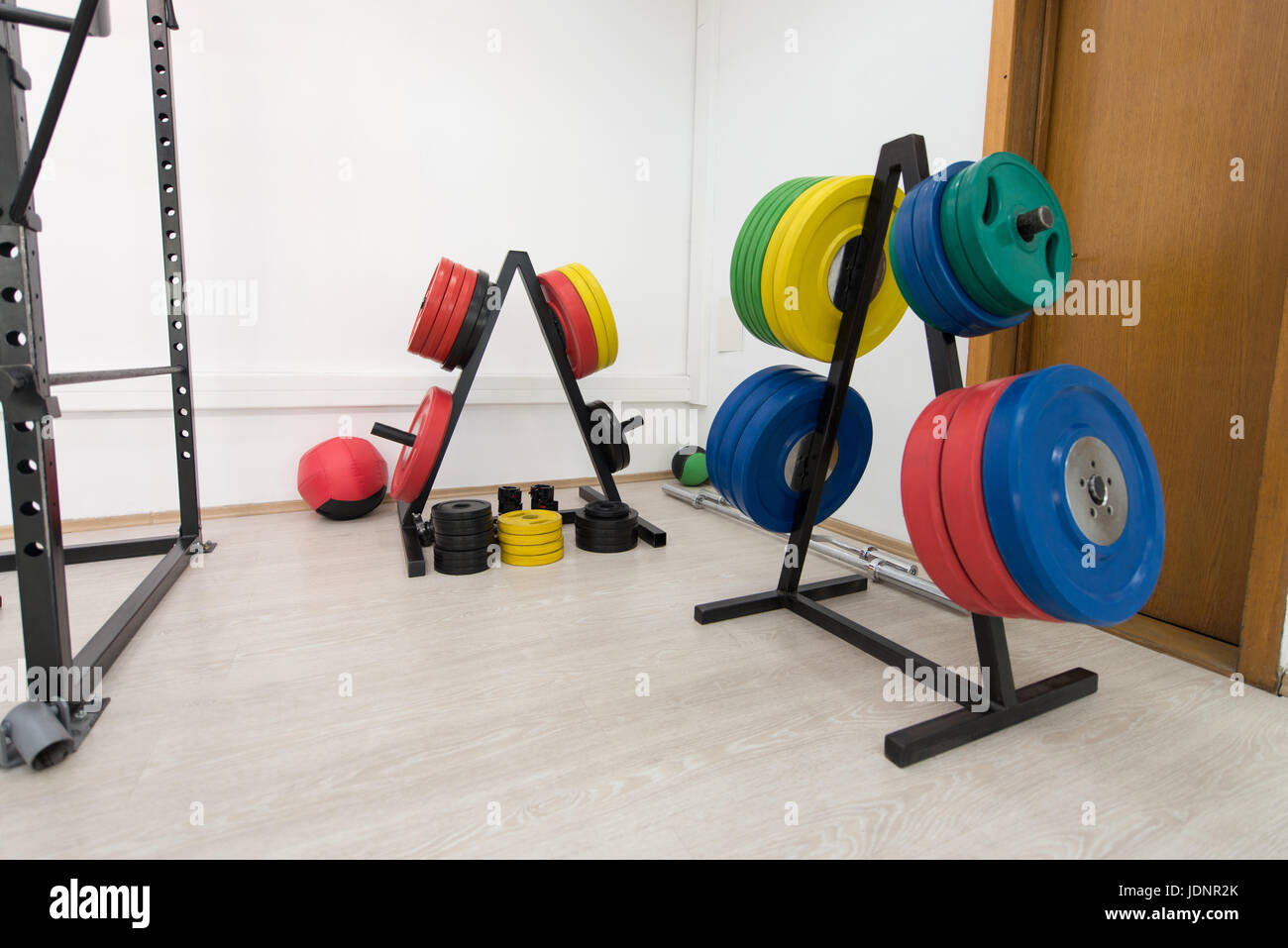 Stand With Weights in Gym Stock Photo - Alamy