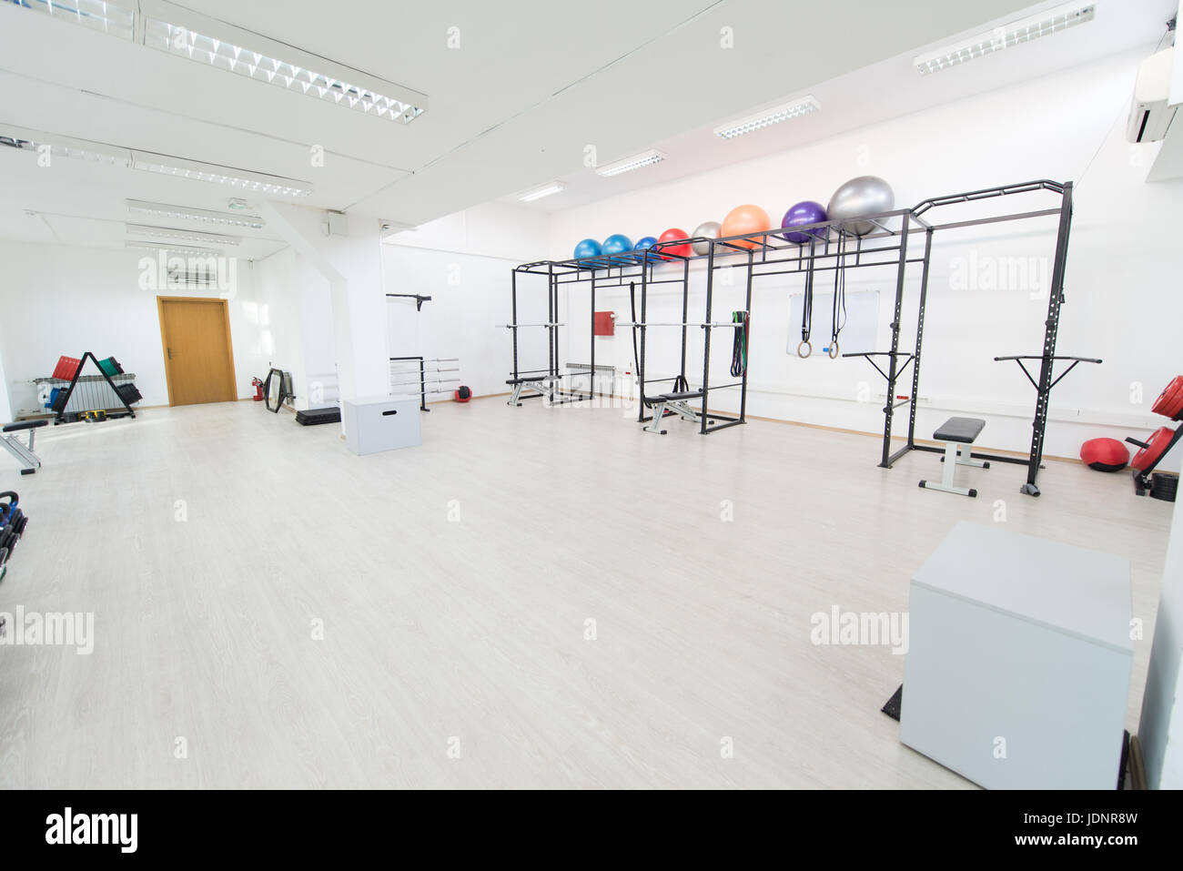 Modern Gym Room Fitness Center With Equipment And Machines Stock Photo ...
