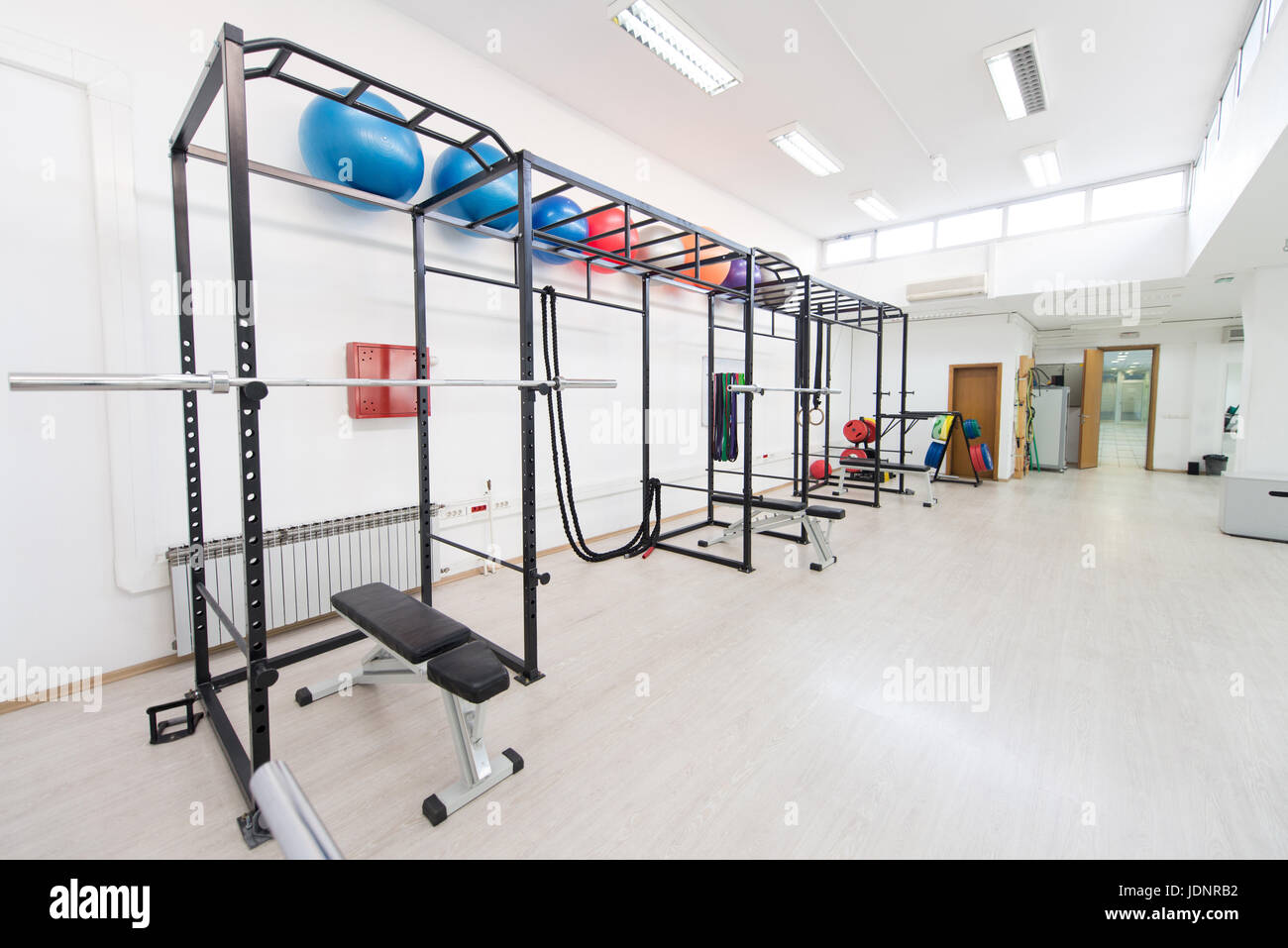 Modern Gym Room Fitness Center With Equipment And Machines Stock Photo ...