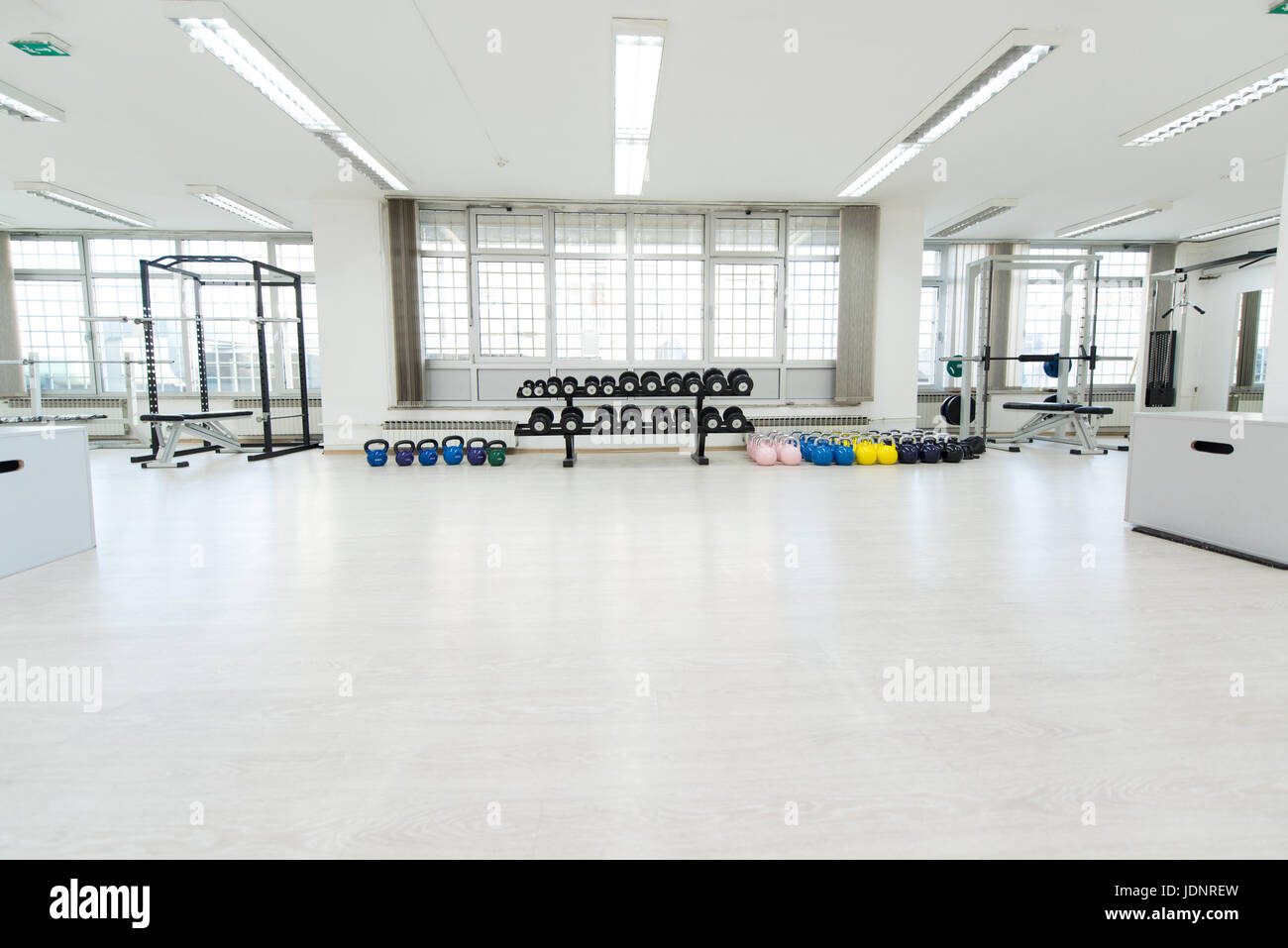 Modern Gym Room Fitness Center With Equipment And Machines Stock Photo ...