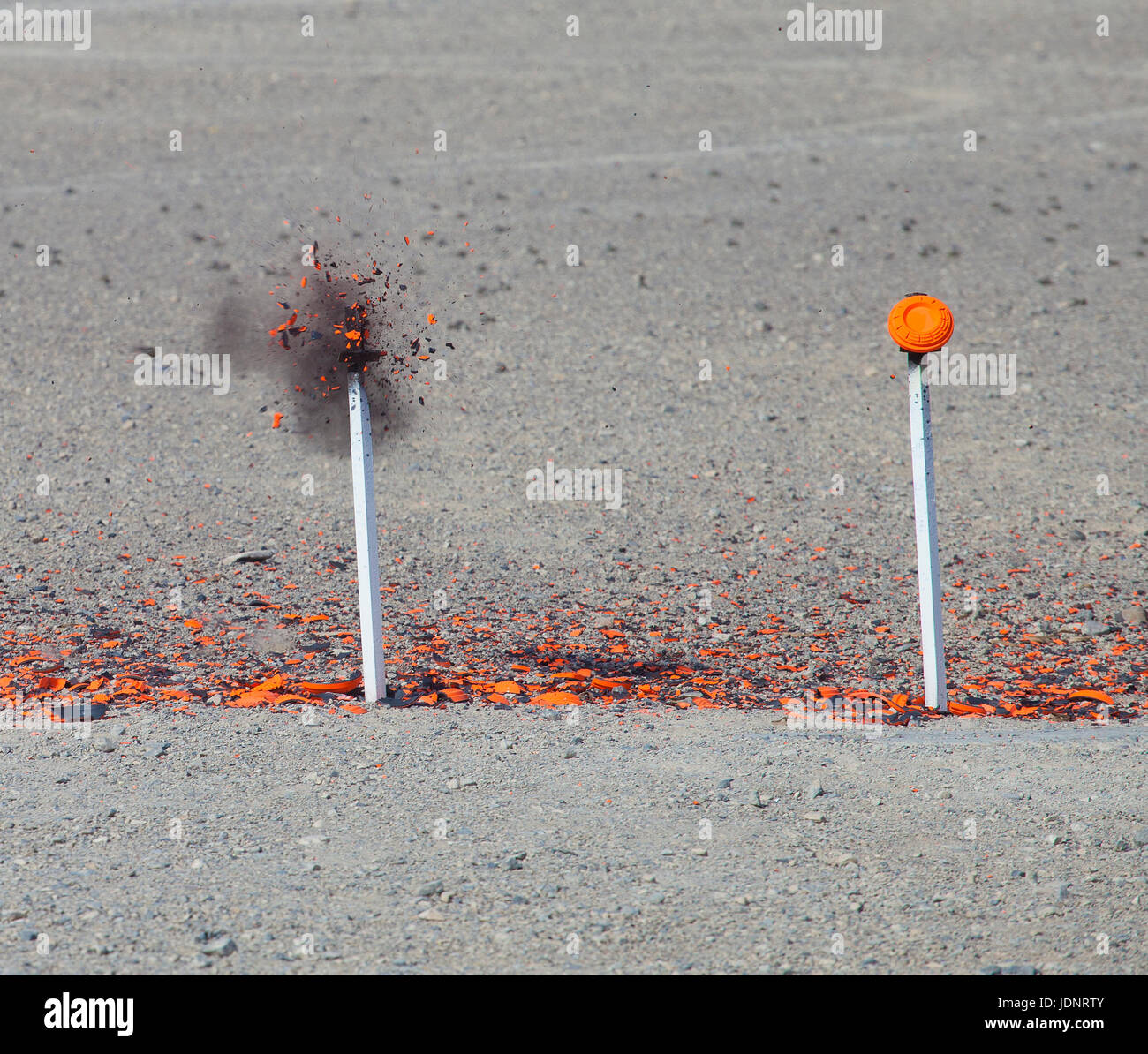 Clay shooting target shatters while another awaits its fate Stock Photo ...