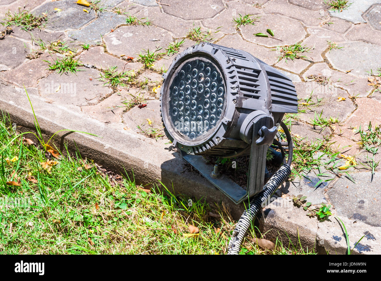 Old LED Spotlight on Concrete Brick Ground, Outdoor Stock Photo - Alamy