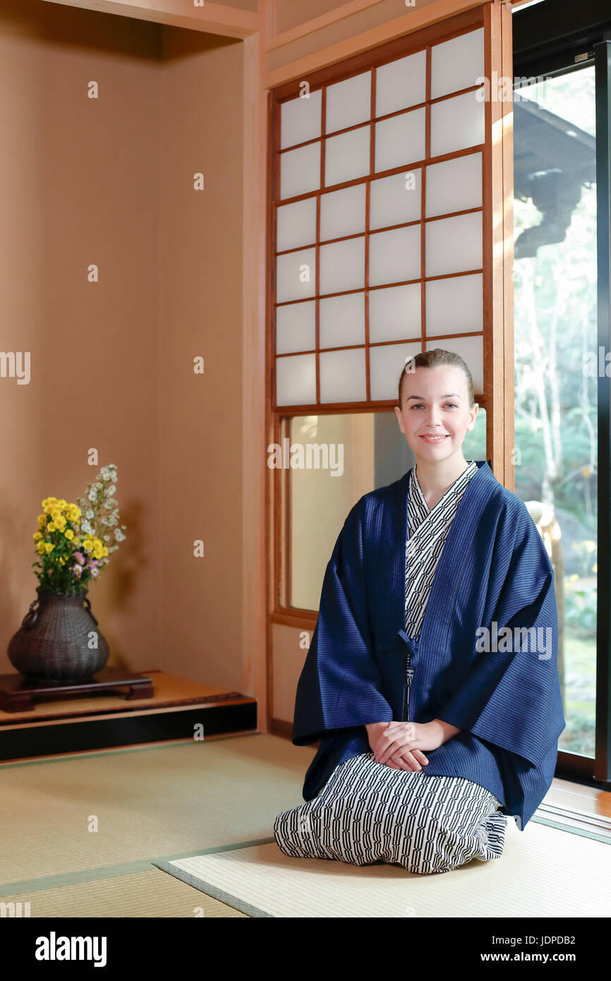 Caucasian woman wearing yukata at traditional ryokan, Tokyo, Japan ...