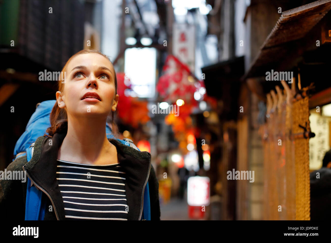 Caucasian backpacker downtown Tokyo at night, Tokyo, Japan Stock Photo ...