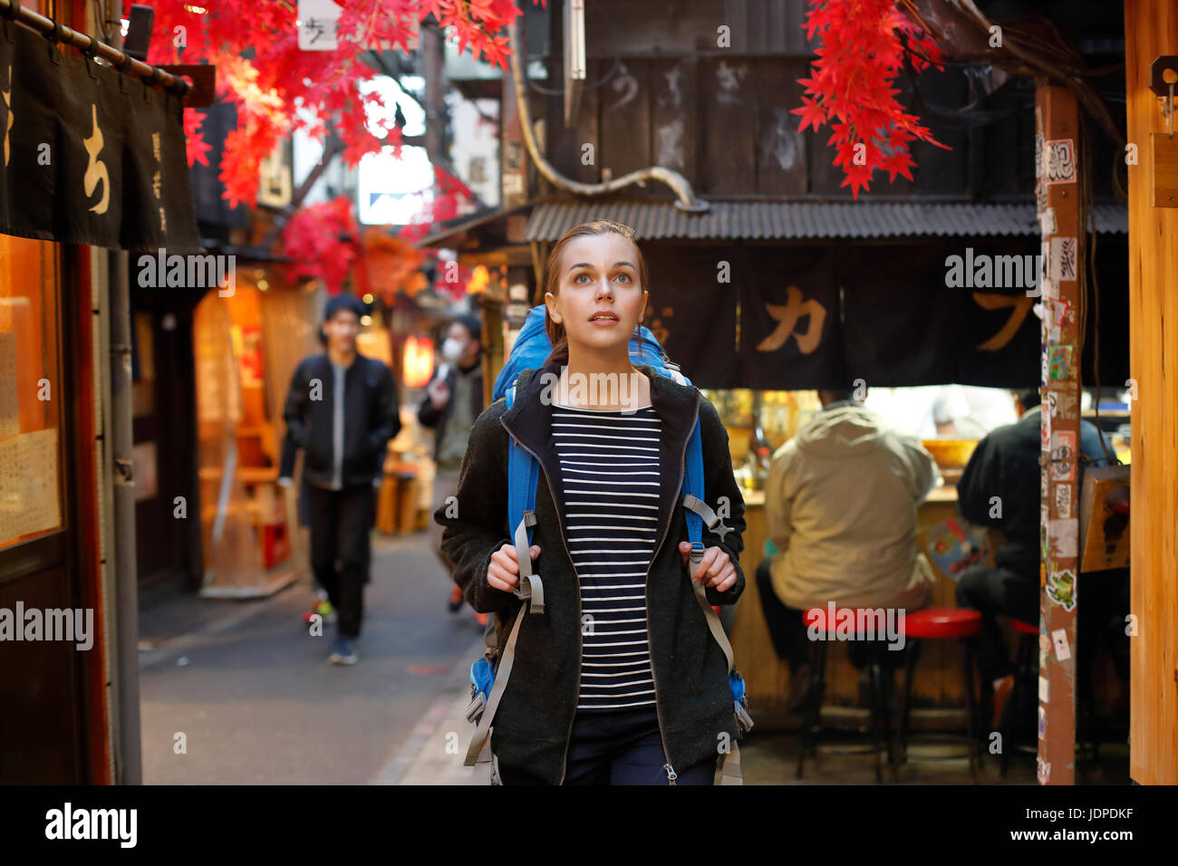 Caucasian backpacker downtown Tokyo at night, Tokyo, Japan Stock Photo ...