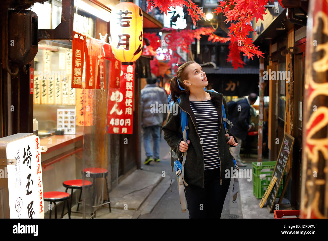 Caucasian backpacker downtown Tokyo at night, Tokyo, Japan Stock Photo ...