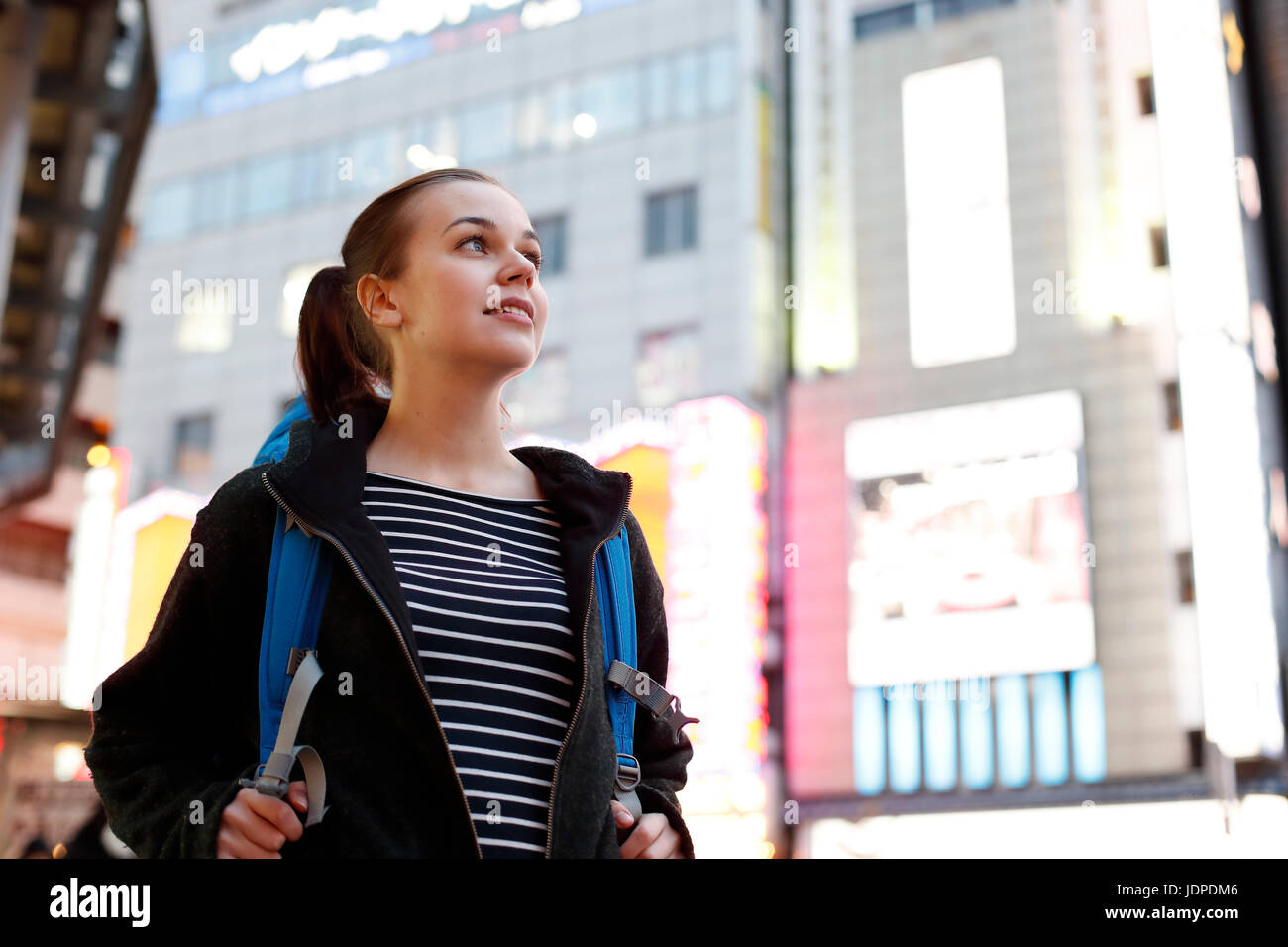Caucasian backpacker downtown Tokyo at night, Tokyo, Japan Stock Photo ...