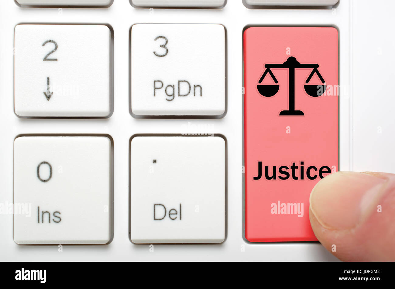 Red justice key on keyboard Stock Photo - Alamy