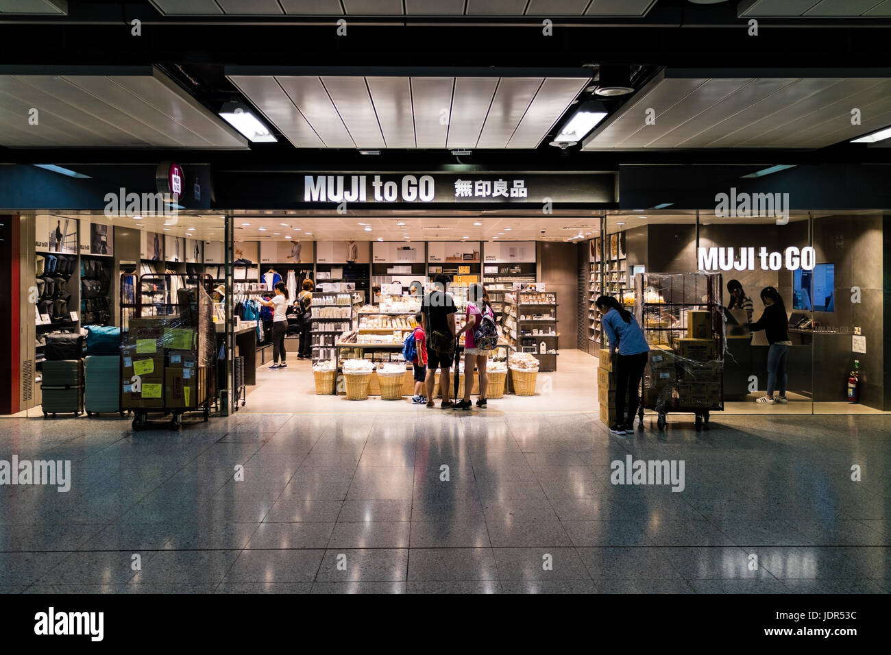 Muji to Go branch store, employee unpacking boxes, family shopping, in ...