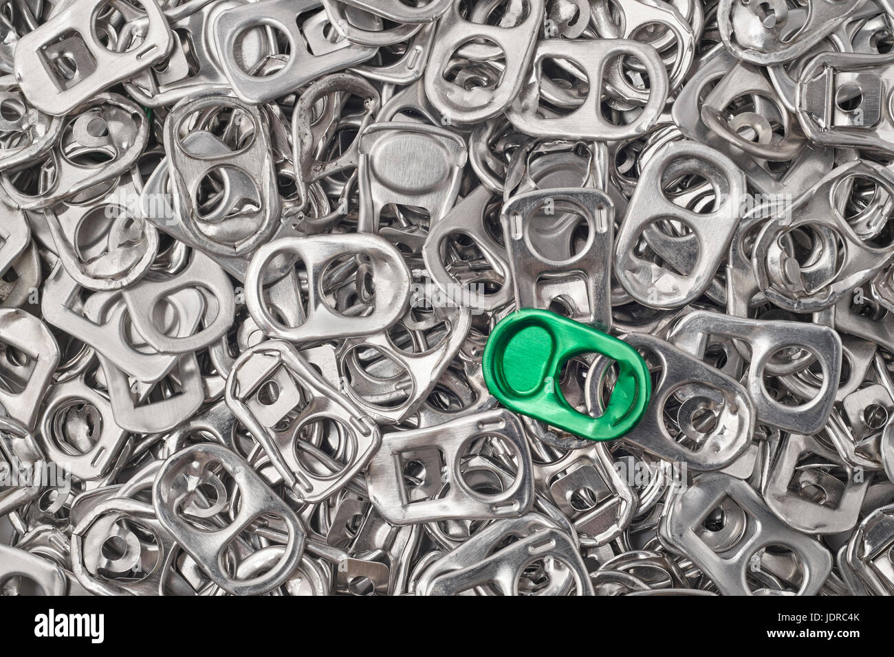 Recycling aluminum background with pull-tab pieces. Metallic waste ...