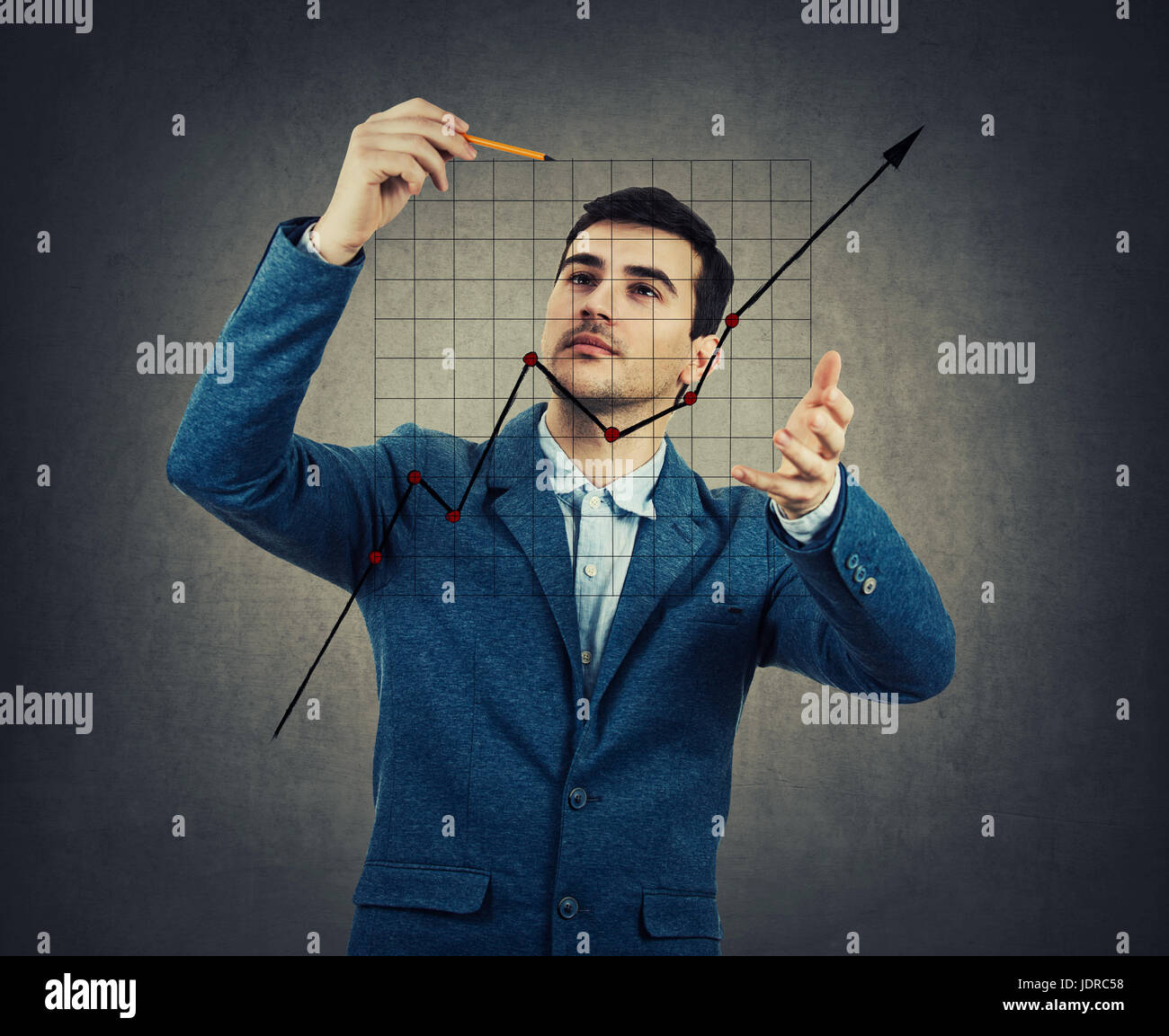 Creative businessman drawing a rising graph. Concept of analysing and ...