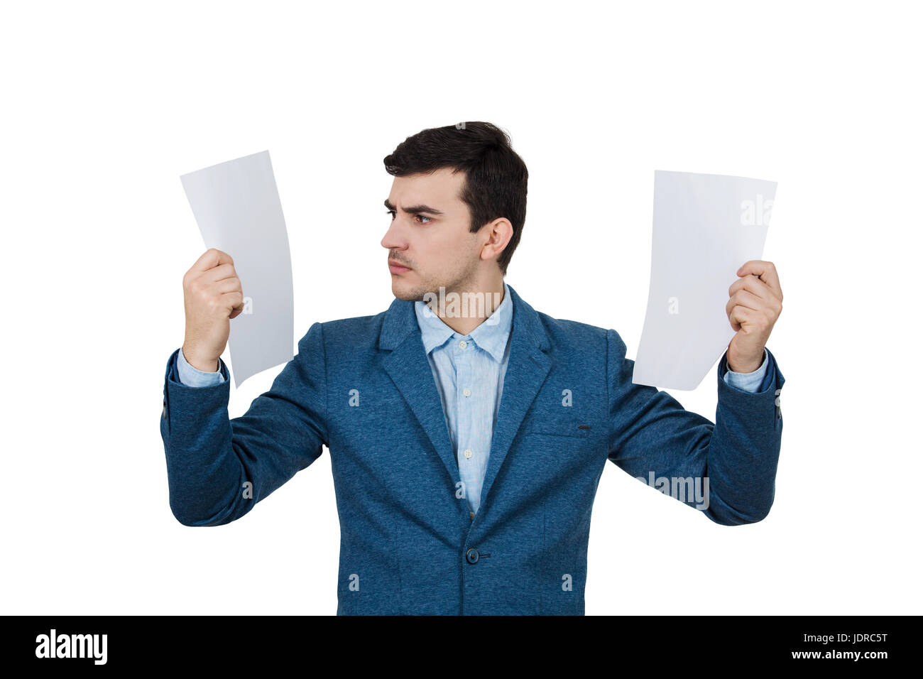 Surprised young businessman looking to a white paper.Shocked young man ...