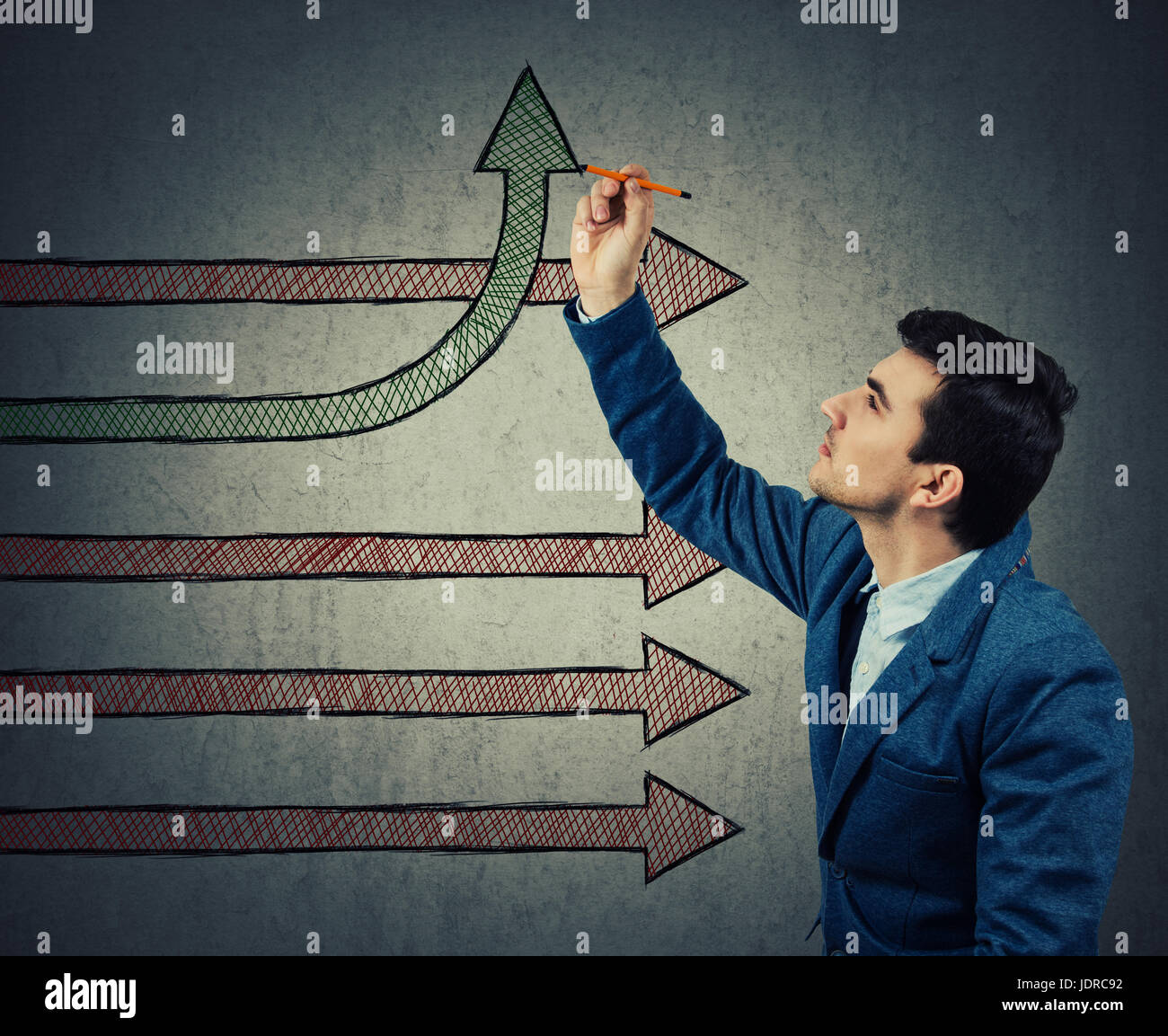 Businessman draw imaginative arrows one of them change its direction ...