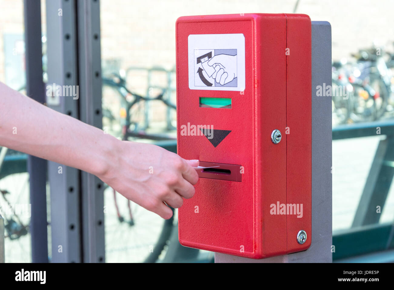 Validate a ticket at a red ticket validation machine for the ...