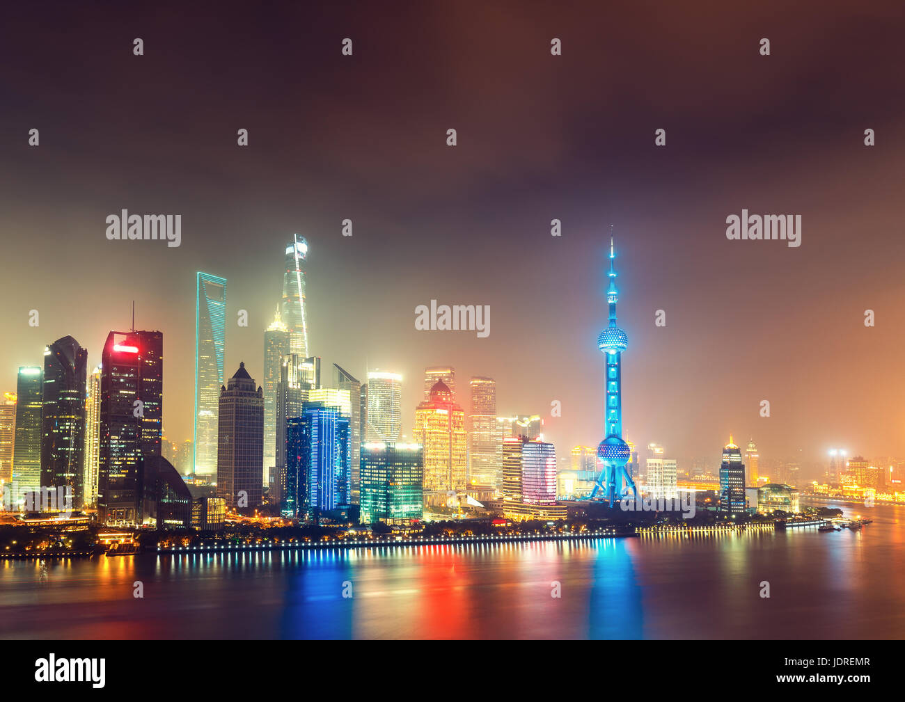 Aerial panoramic view over a big modern city by night. Shanghai, China ...