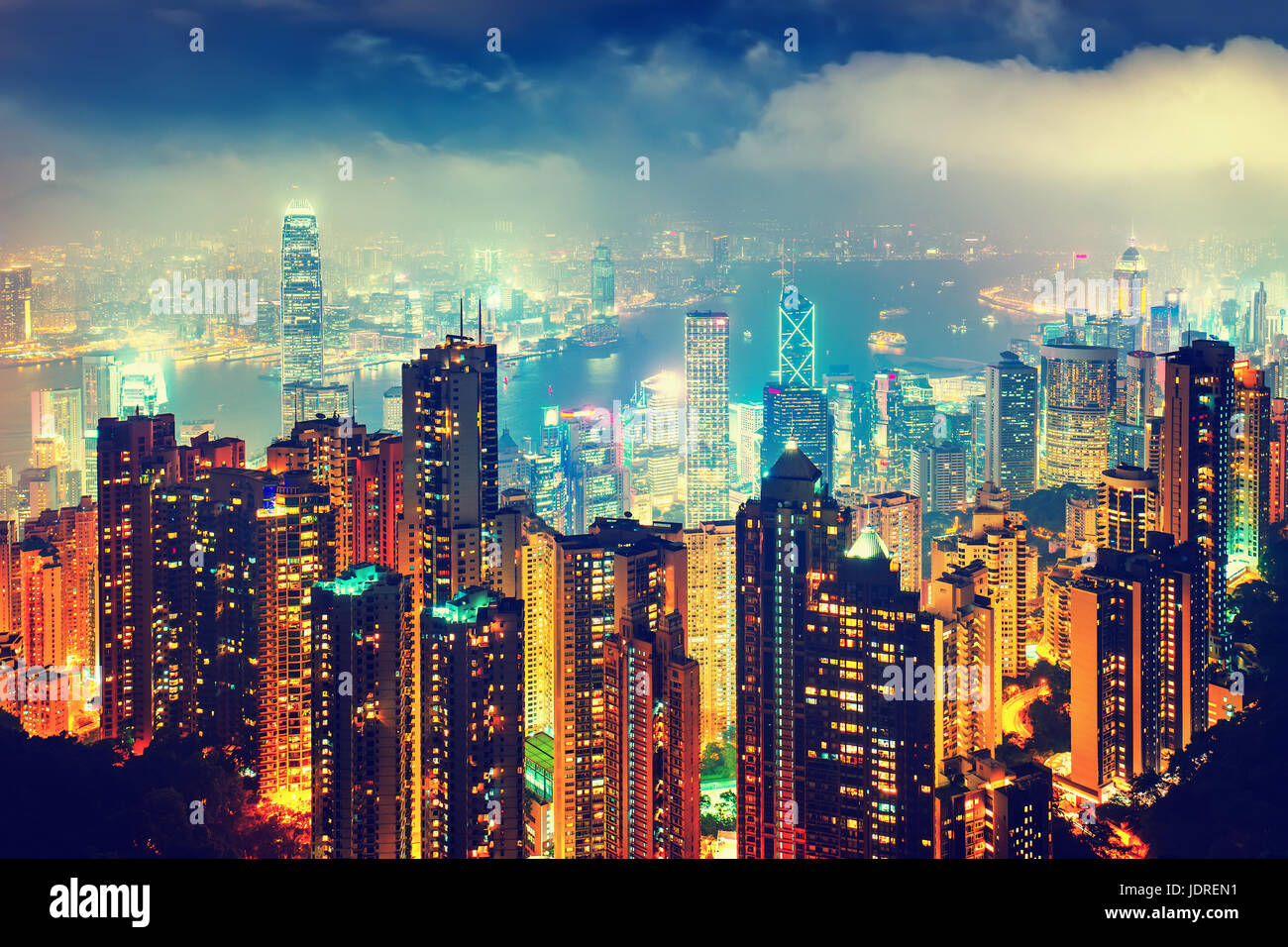 Scenic view over Hong Kong, China, by night. Nighttime skyline with illuminated skyscrapers seen ...