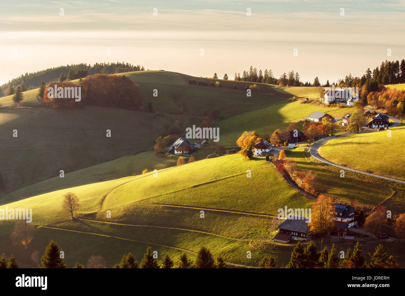 Scenic autumn countryside landscape at sunset. View over a traditional ...