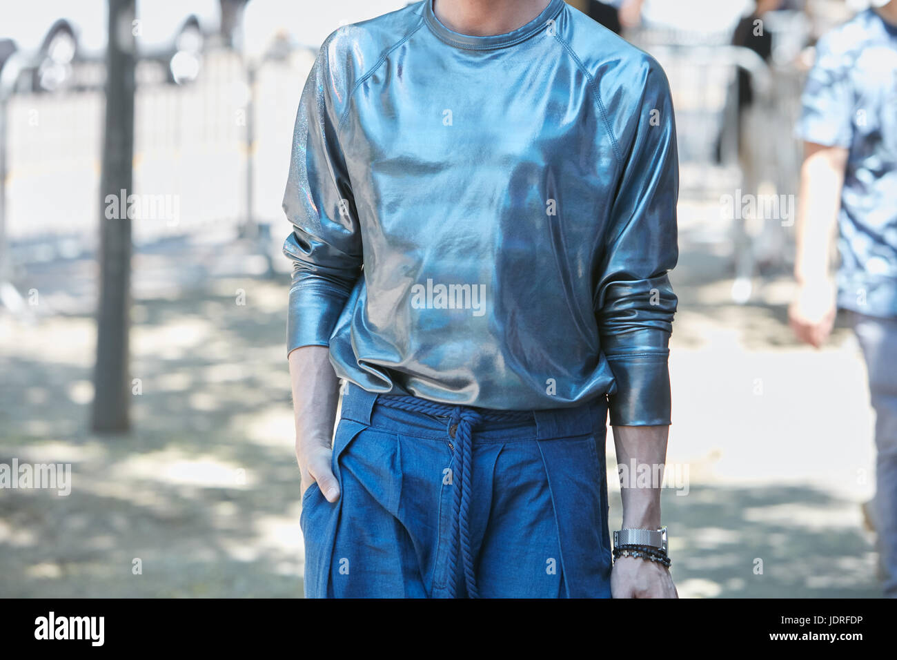 MILAN - JUNE 19: Man with blue metallic shirt and trousers before Fendi ...