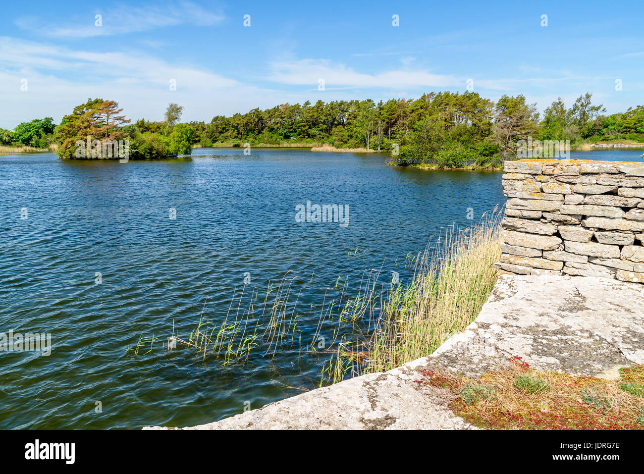 Waterfilled limestone quarry turned into a recreational hiking area ...