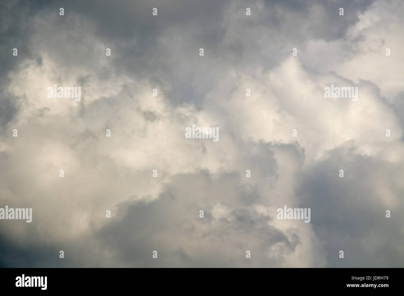 Gray cumulus clouds in front of a thunderstorm. Closeup Stock Photo - Alamy