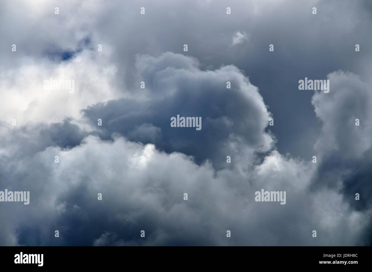Gray cumulus clouds in front of a thunderstorm. Closeup Stock Photo - Alamy