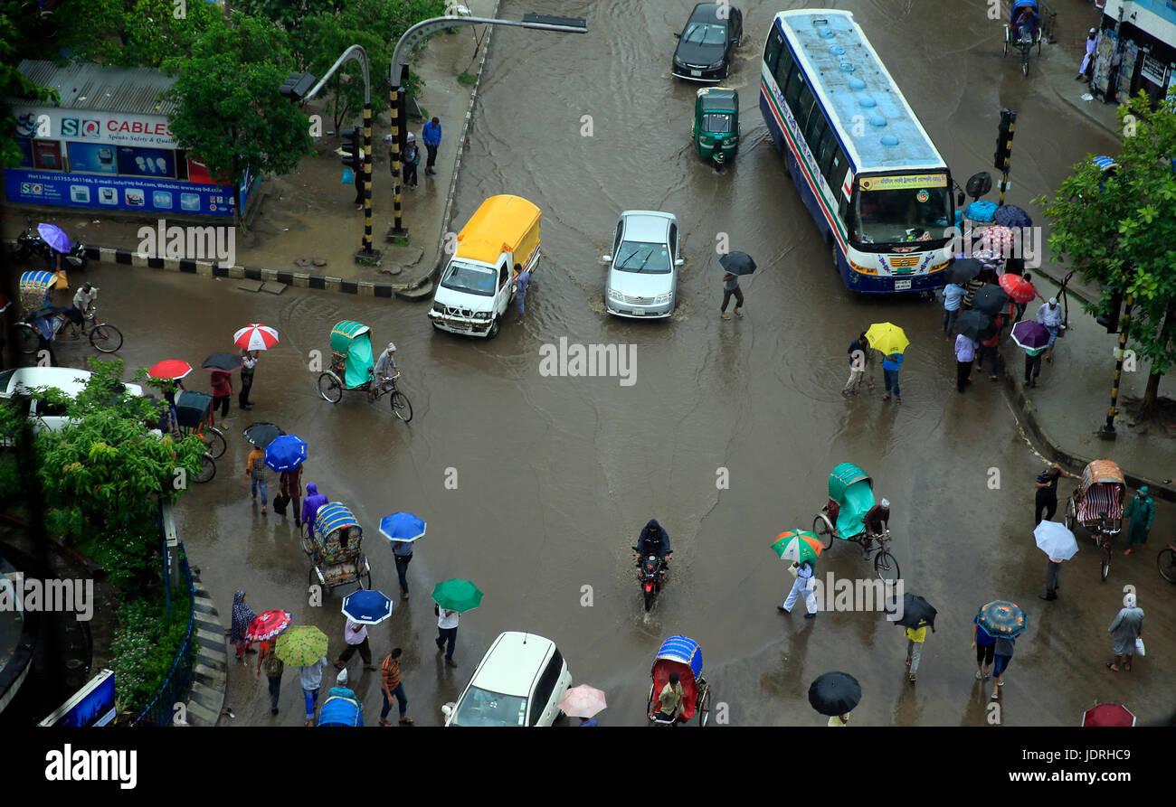 Commuters walk through the heavy rain in the capitals and several other ...