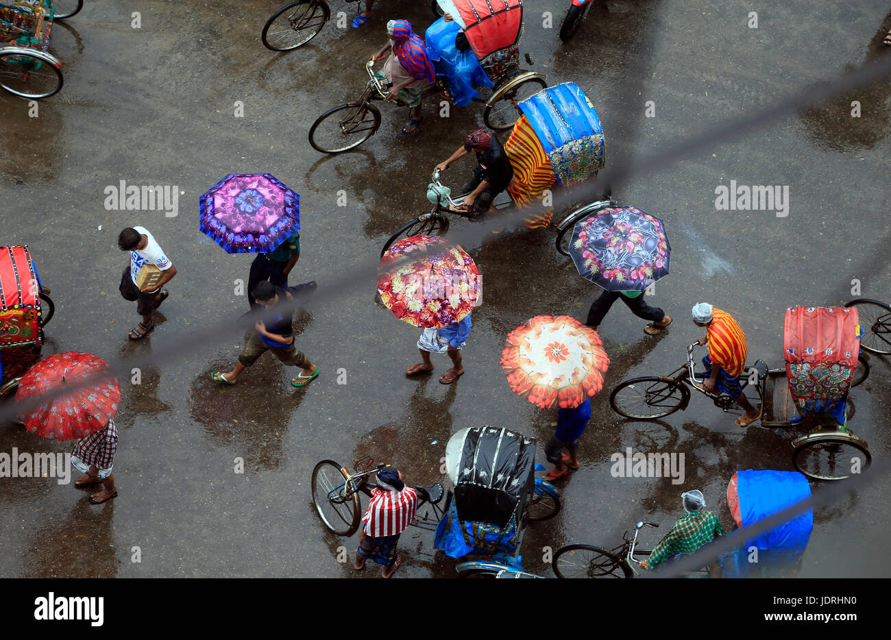 Commuters walk through the heavy rain in the capitals and several other ...