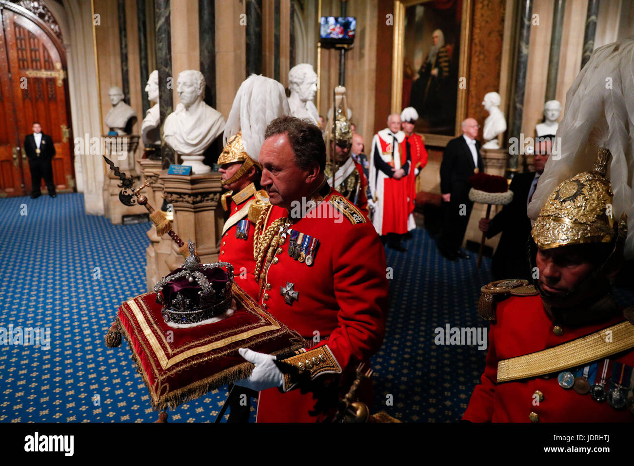 Lieutenant Colonel Andrew Ford (centre) carries the Imperial State ...
