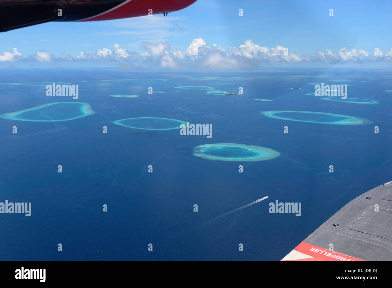 Aerial view of the Maldives taken through the window of a Trans ...