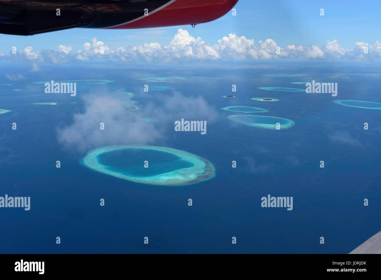 Aerial view of the Maldives taken through the window of a Trans ...