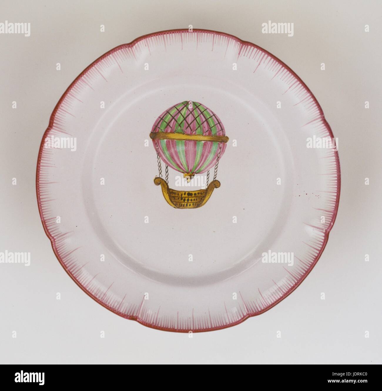 Faience plate with polychrome decoration with curved edging, Les ...