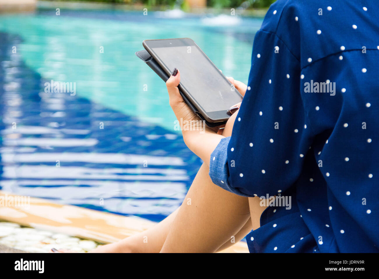 woman touch screen on smartphone with nature background. subject is ...