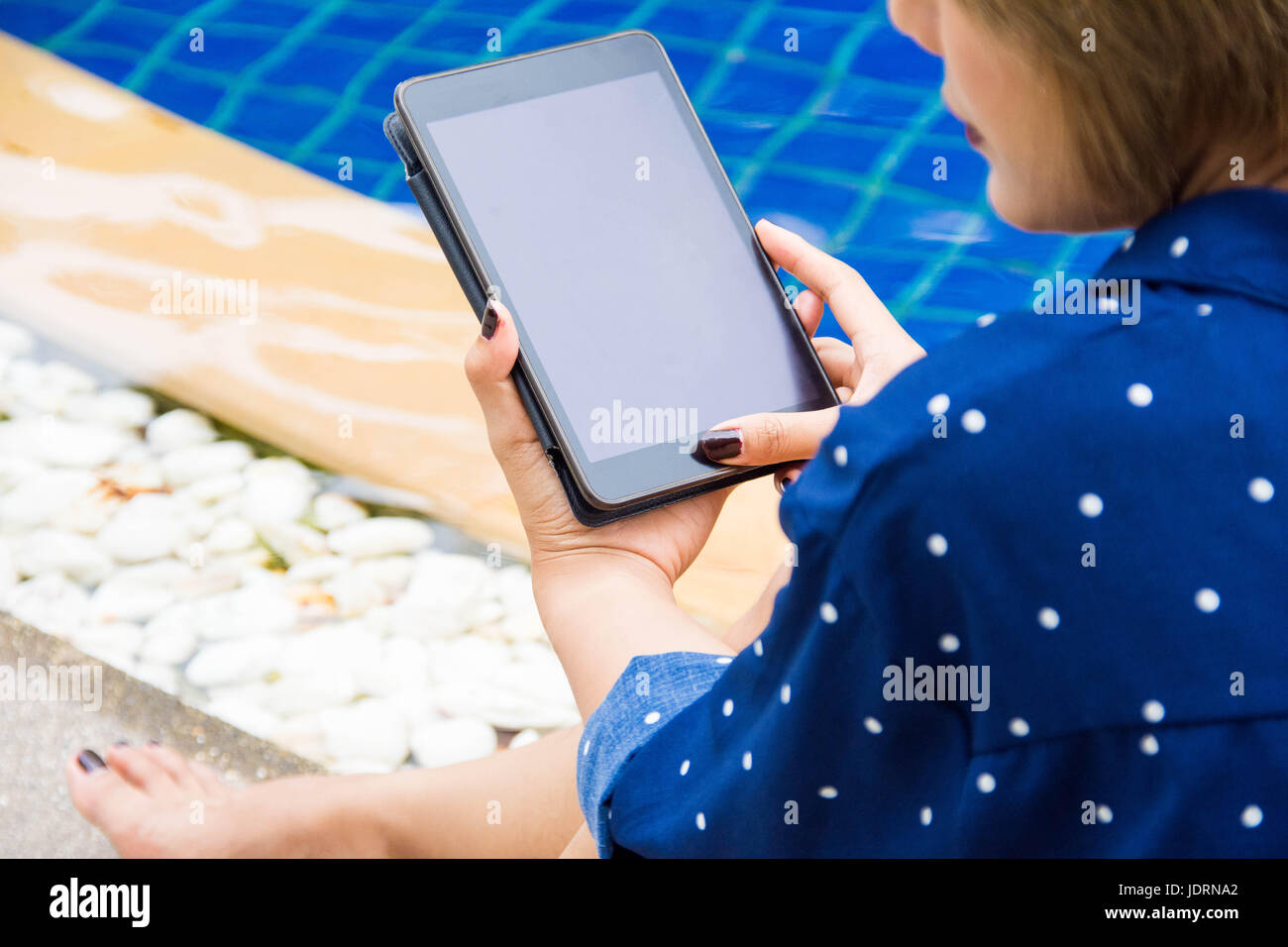 woman touch screen on smartphone with nature background. subject is ...