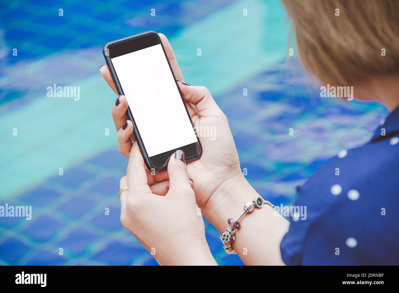 woman touch screen on smartphone with nature background. subject is ...