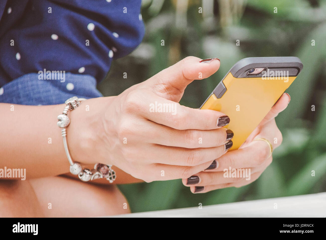woman touch screen on smartphone with nature background. subject is ...