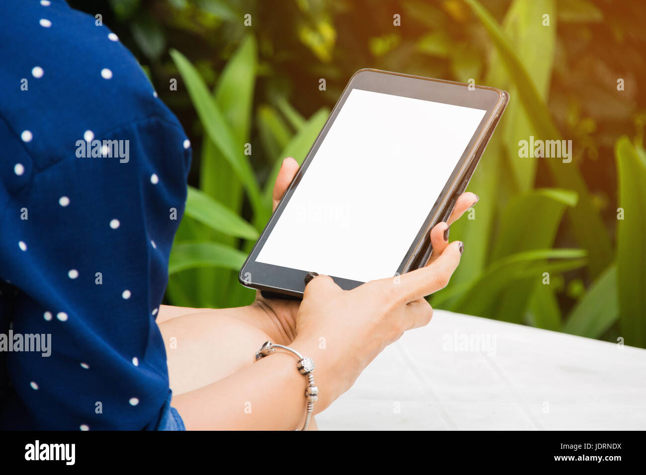 woman touch screen on smartphone with nature background. subject is ...