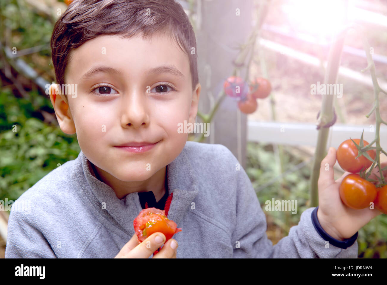 Child eating garden vegetables hi-res stock photography and images - Alamy