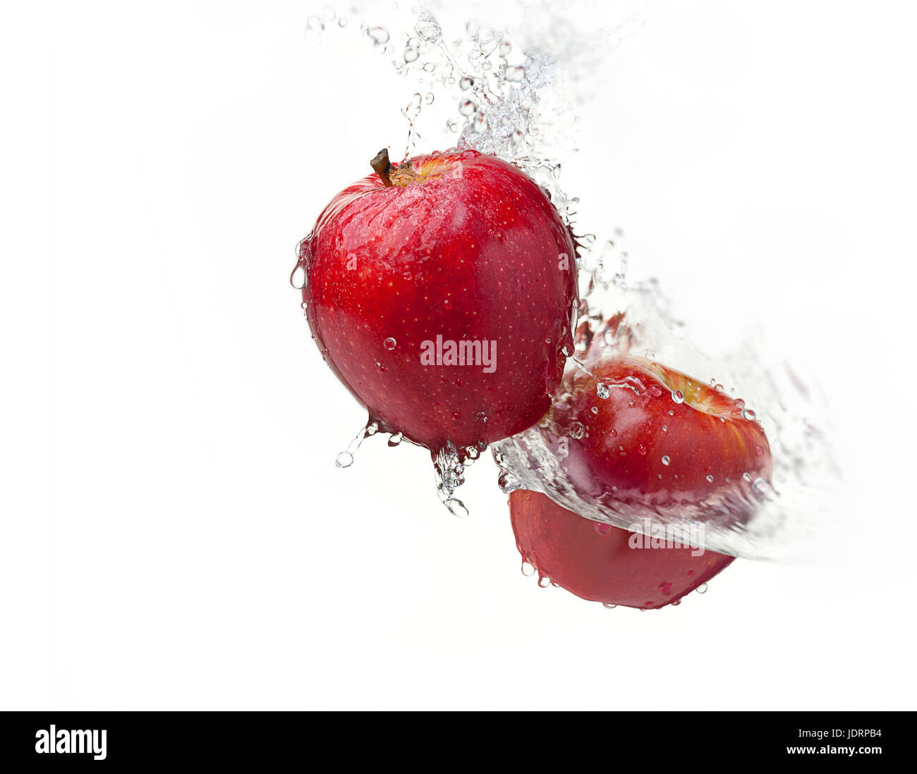 Red apples splash Stock Photo - Alamy