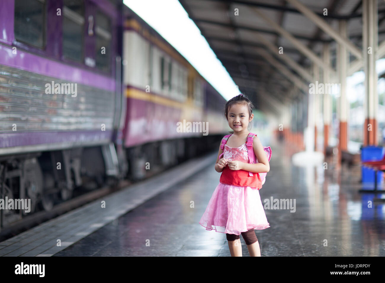 Child Journey by train on platform of railway station in thailand Stock ...