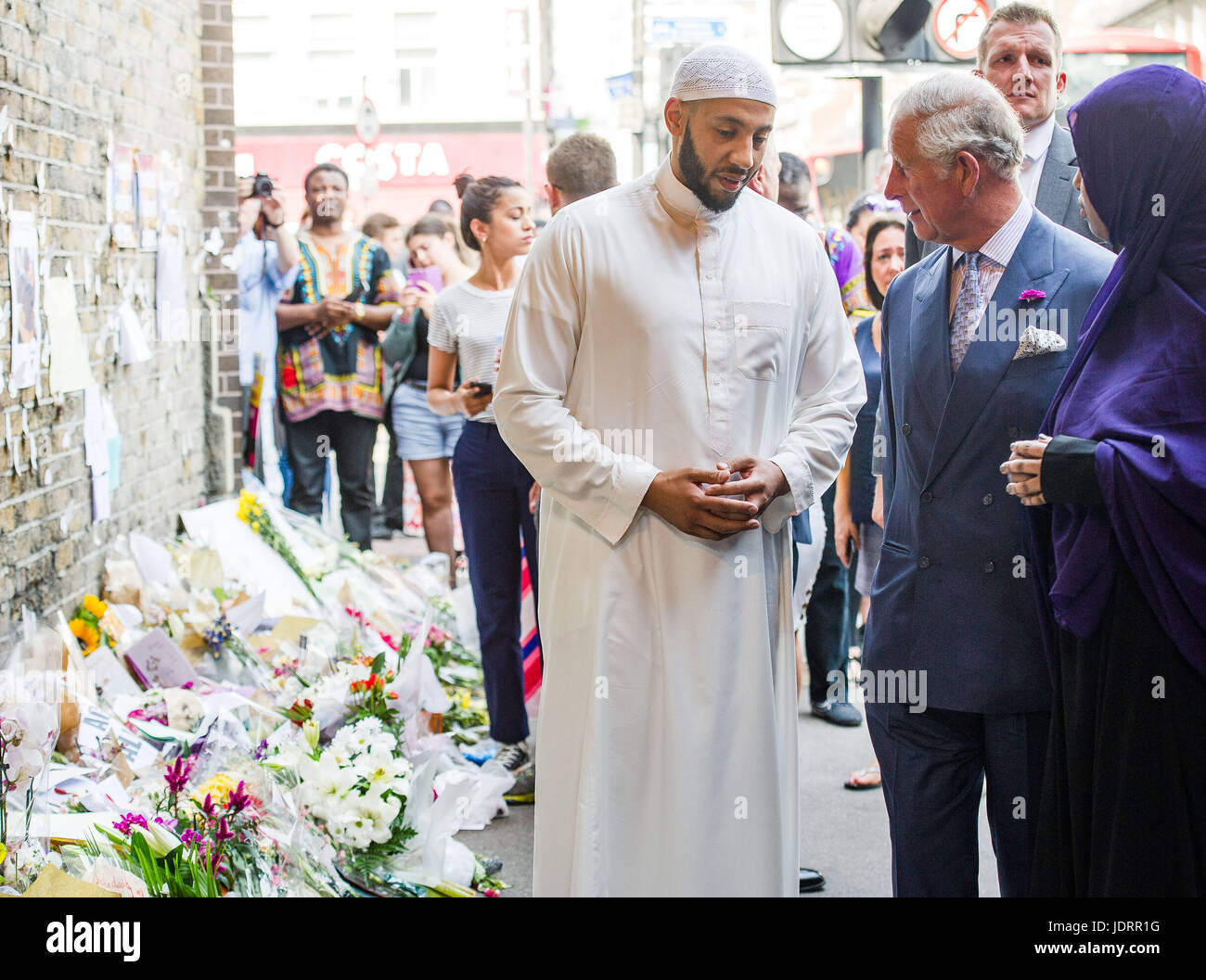 The Prince of Wales visits tributes left at the scene of the Finsbury ...