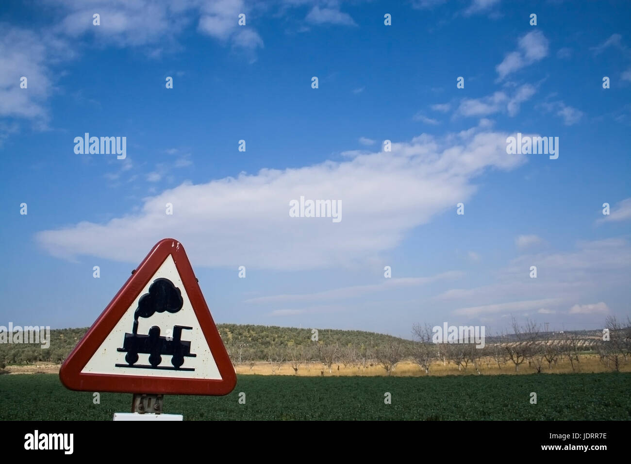 Crossing on the road, step to level without barriers via railway, Spain ...