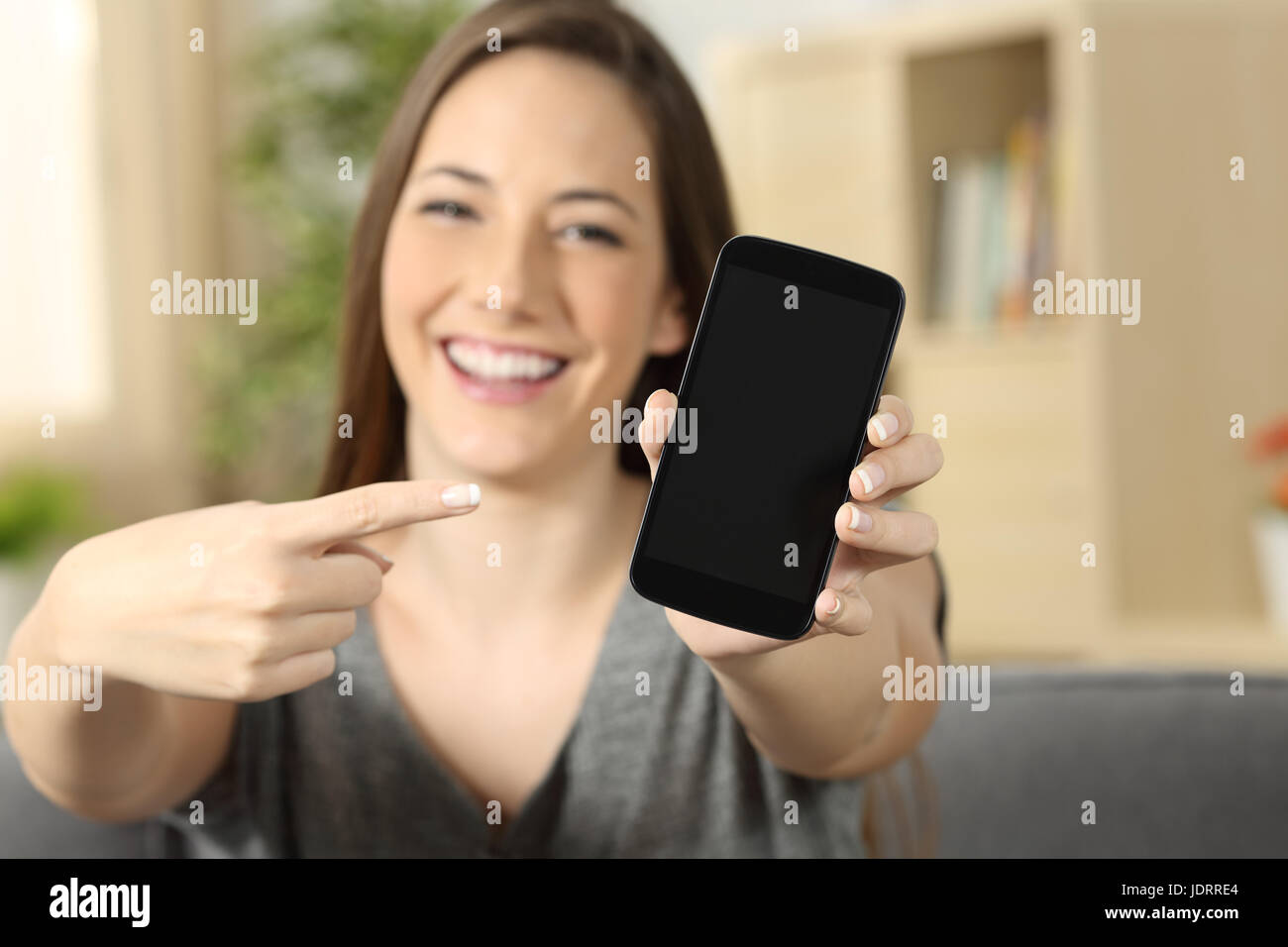 Pointing to cell phone hi-res stock photography and images - Alamy