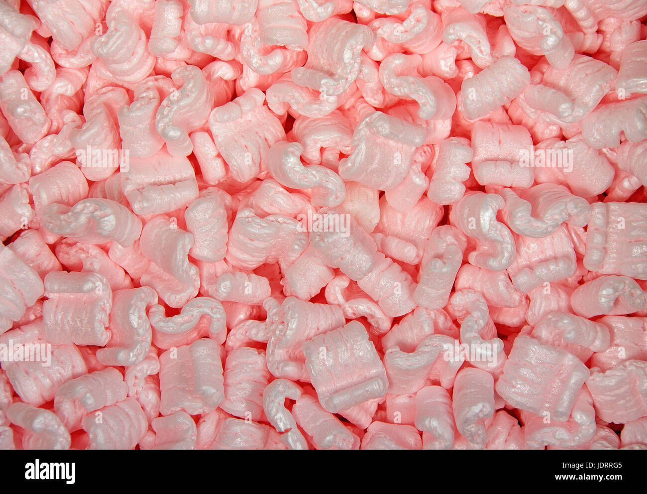 pink styrofoam packing peanuts background Stock Photo - Alamy