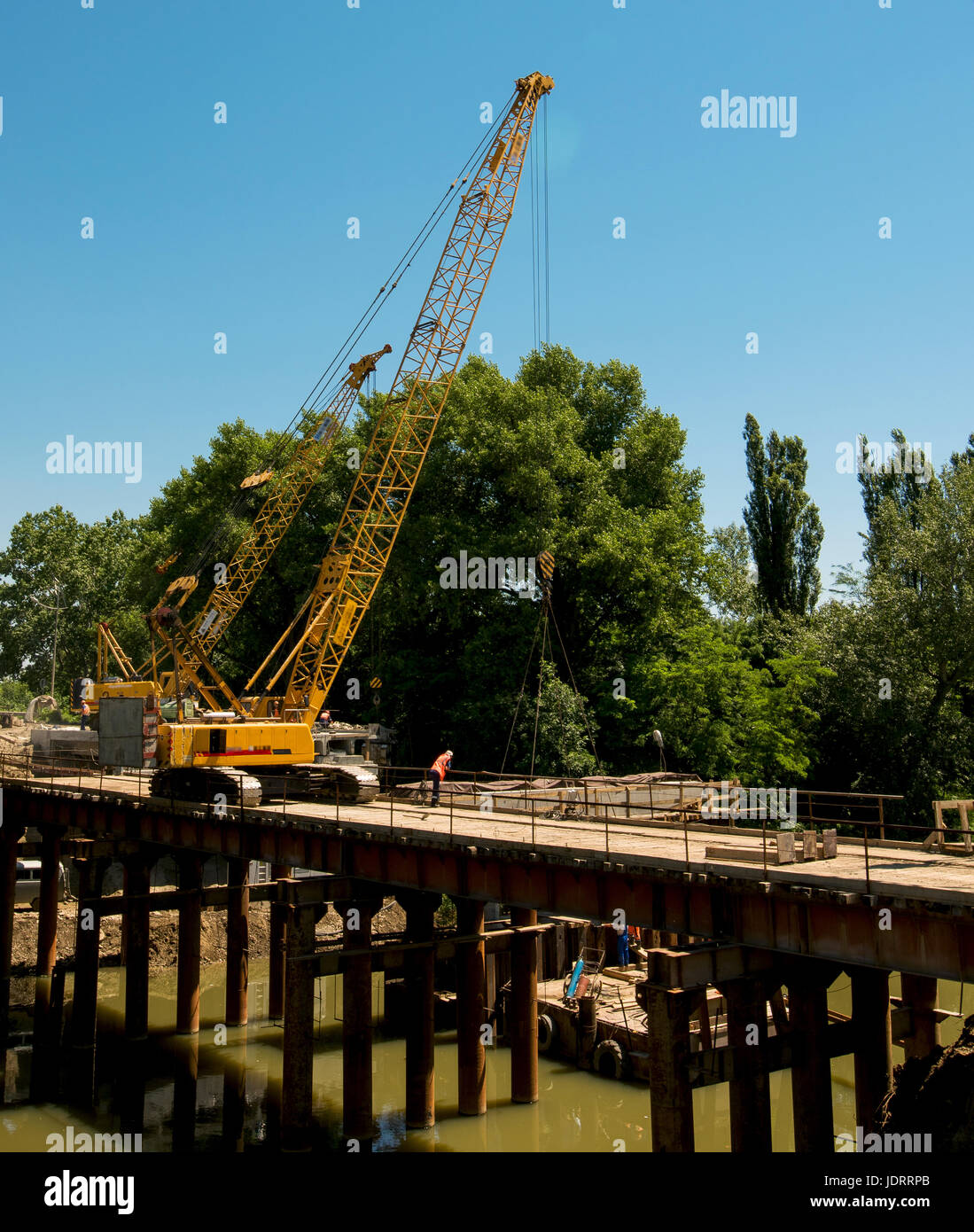 big crawler crane on a bridge Stock Photo - Alamy